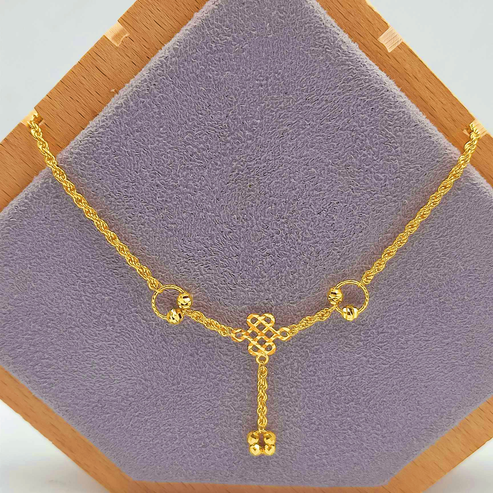 916 GOLD HOLLOW ROPE DANGLING WISHFUL KNOT WITH BALL NECKLACE – Marina ...